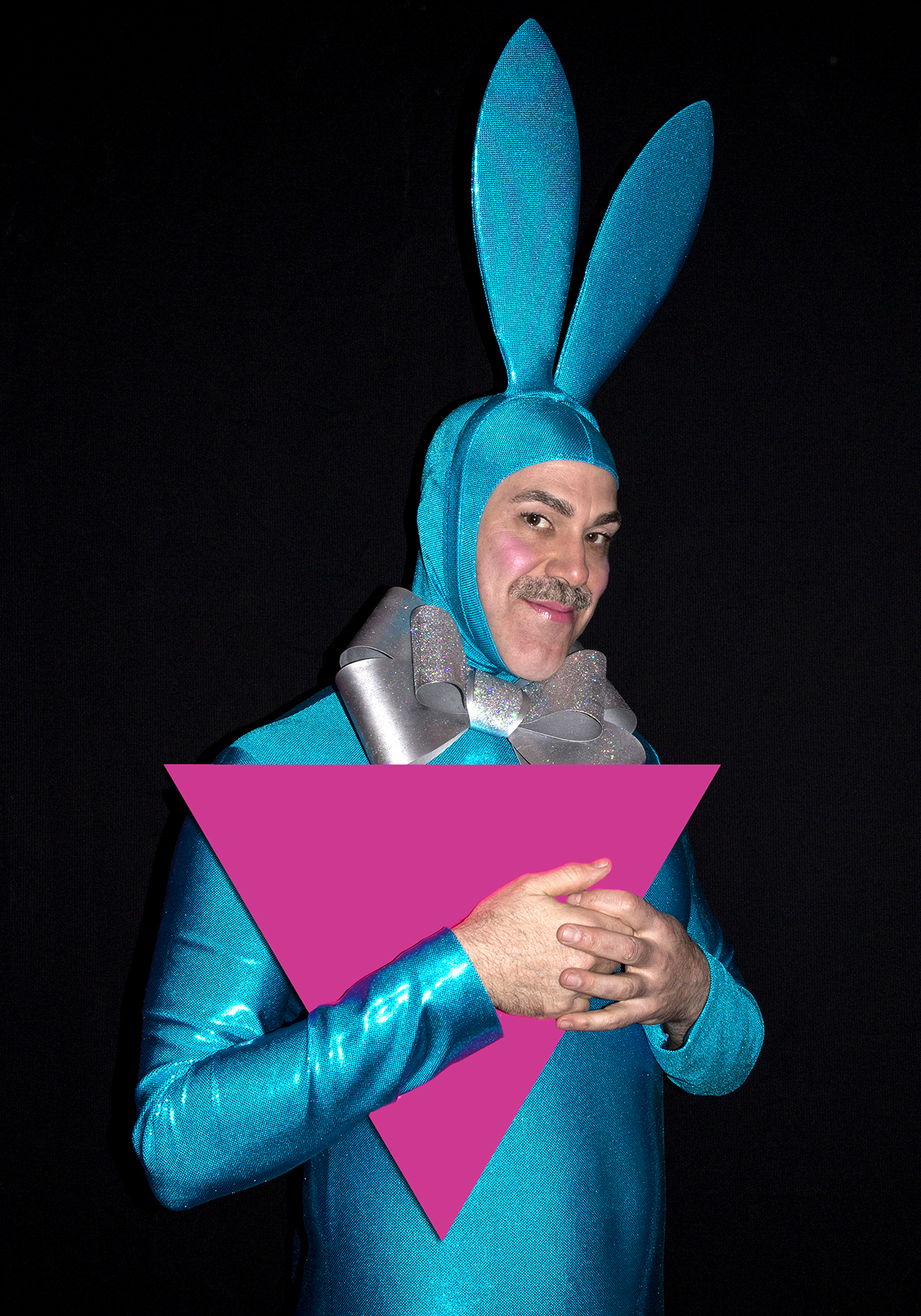 It's time we talk about the giant pink triangle in the room